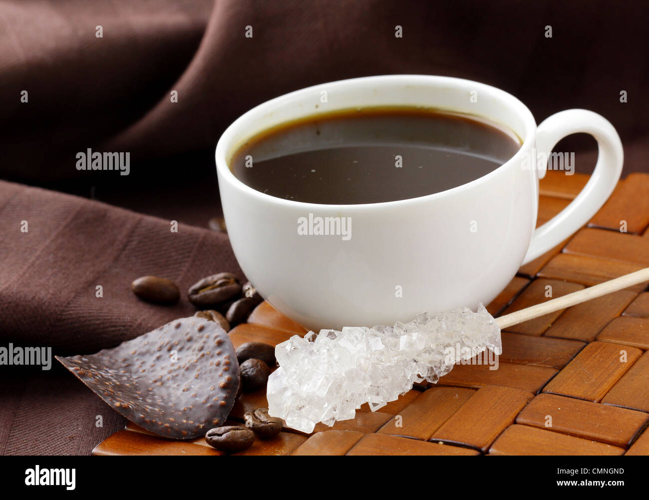 small cup of coffee espresso on a brown background Stock Photo - Alamy