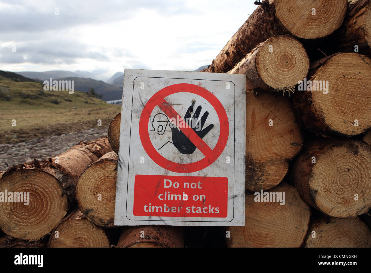 Warning sign - do not climb on timber stacks Stock Photo - Alamy