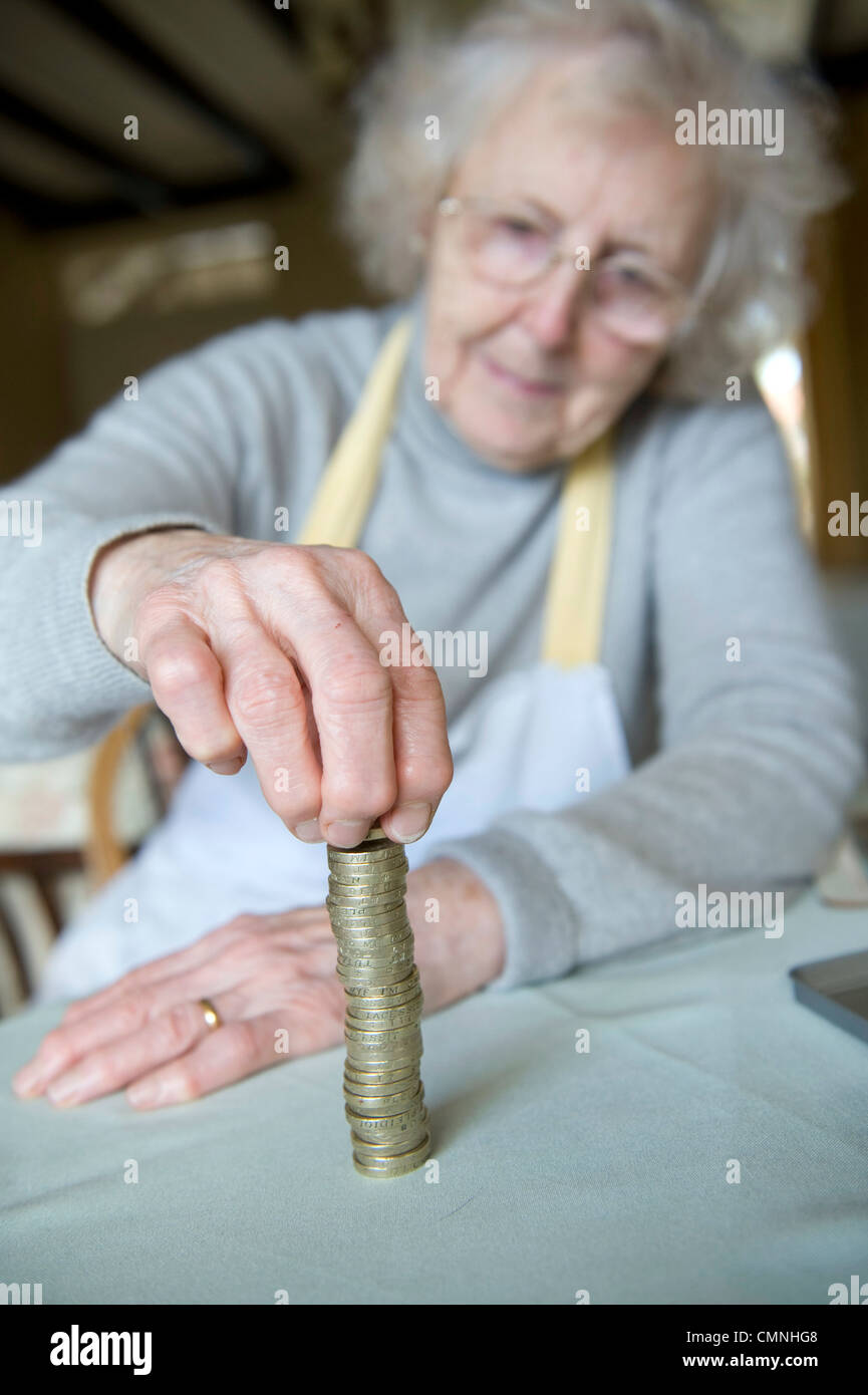Woman counting money uk pound sterling hi-res stock photography and ...