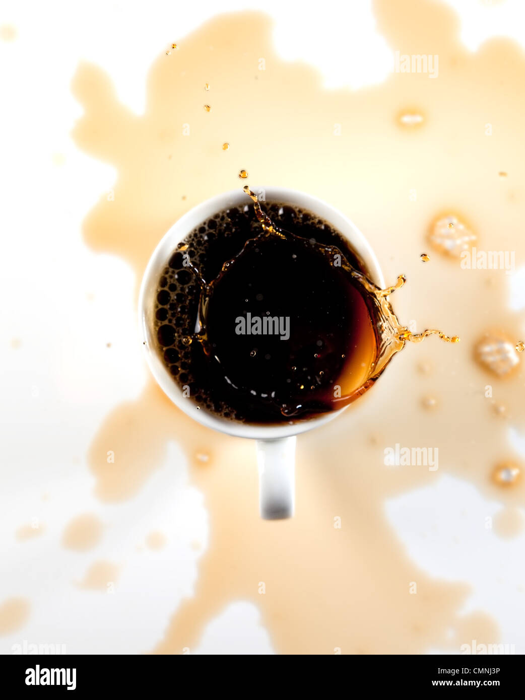 White Coffee Mug with Coffee Splash Stock Photo - Alamy