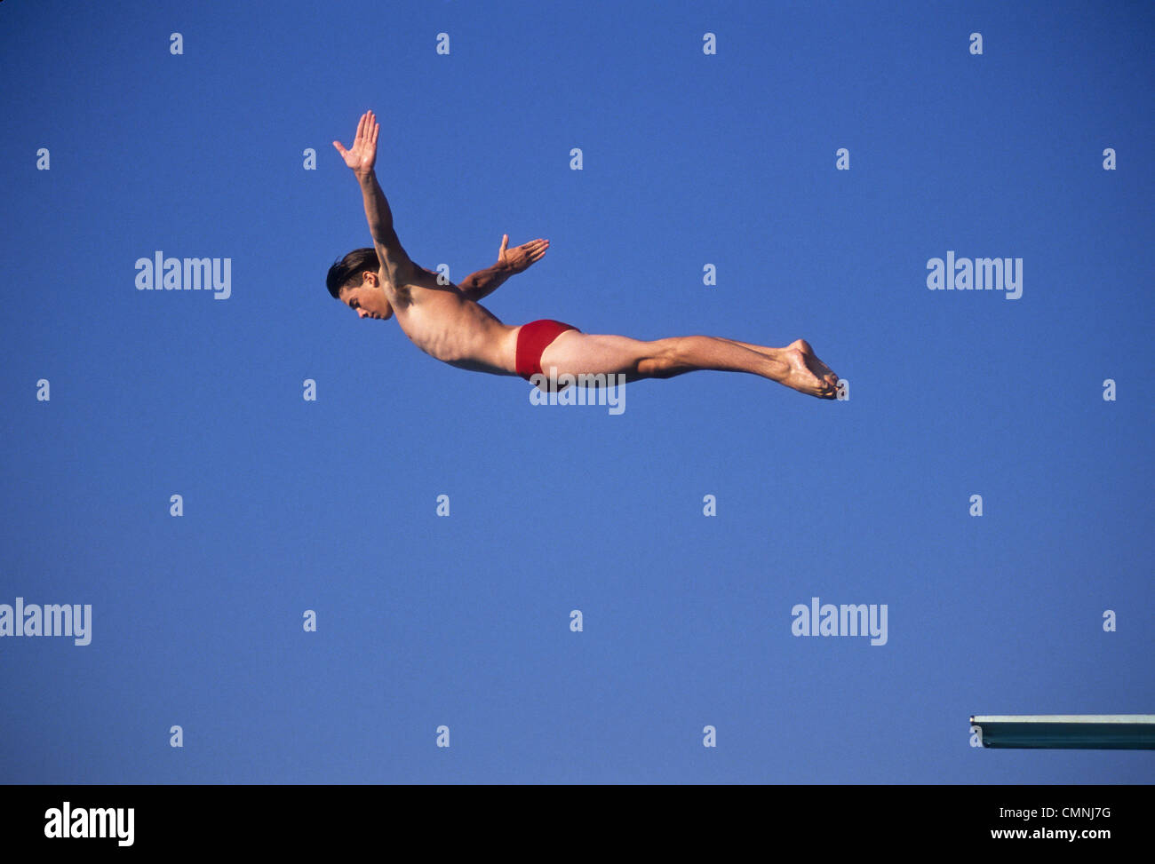 Action of male diver in the air Stock Photo - Alamy