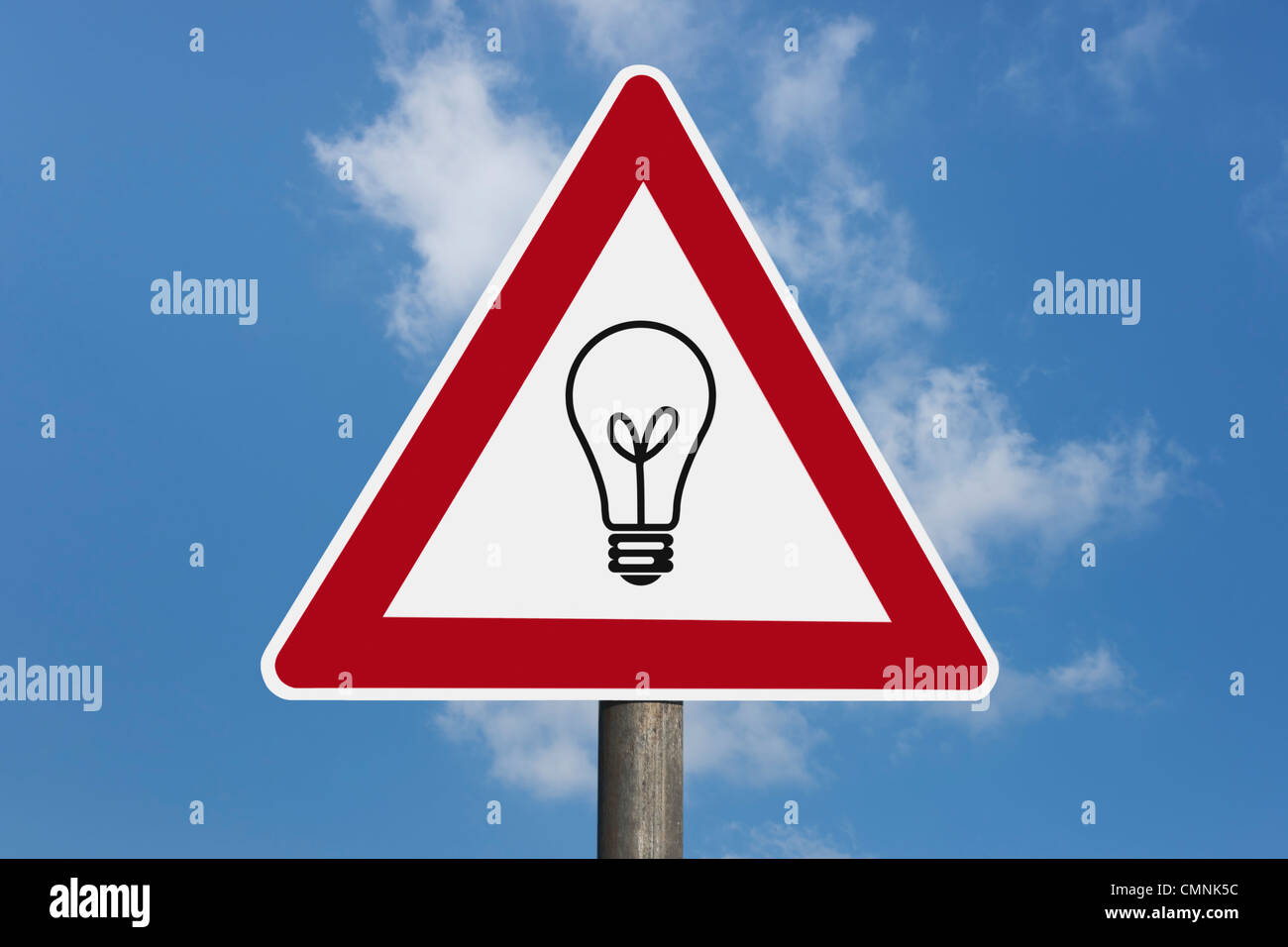 Detail photo of a danger sign with a light bulb in the middle ...