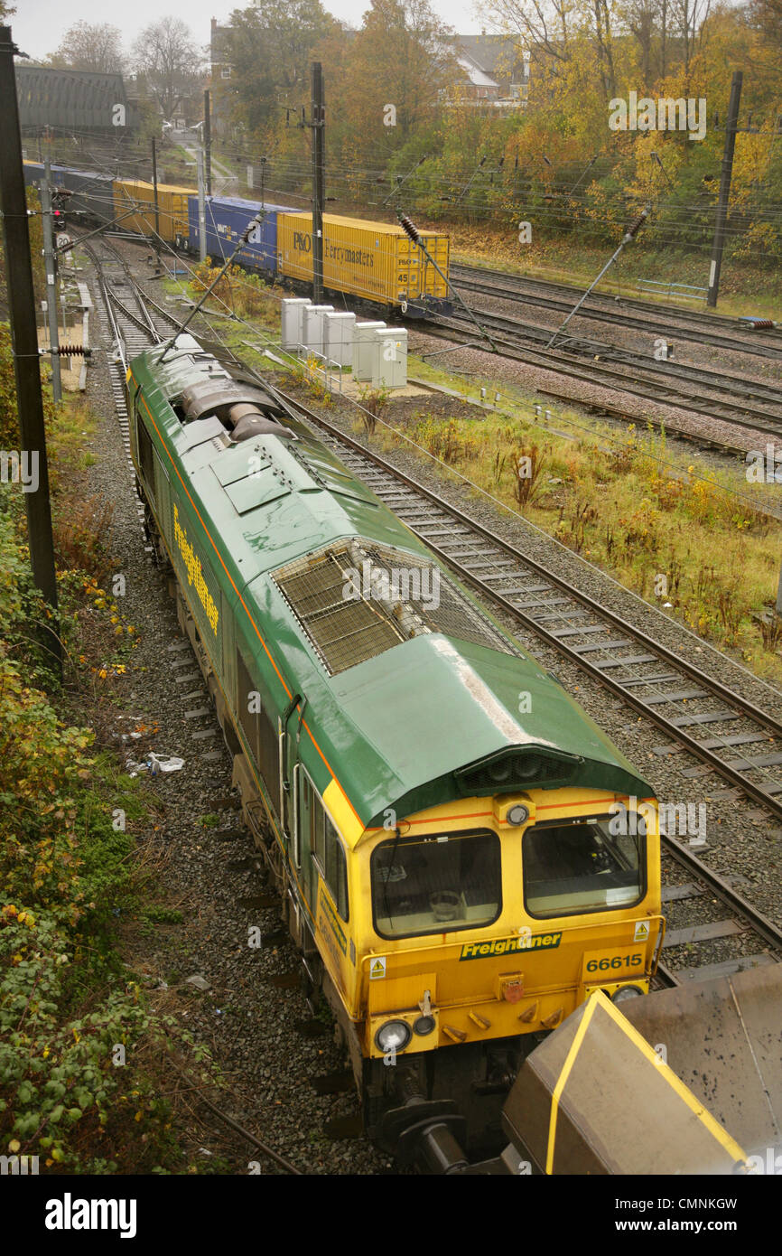 Class 66 diesel locomotive 66615 with train of empty coal wagons, being ...