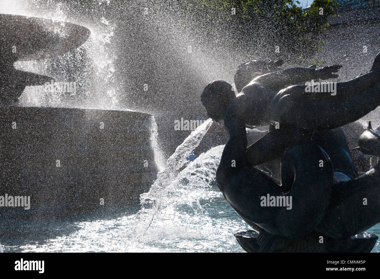 Detail of statue by water fountain in Trafalgar Square, central London ...