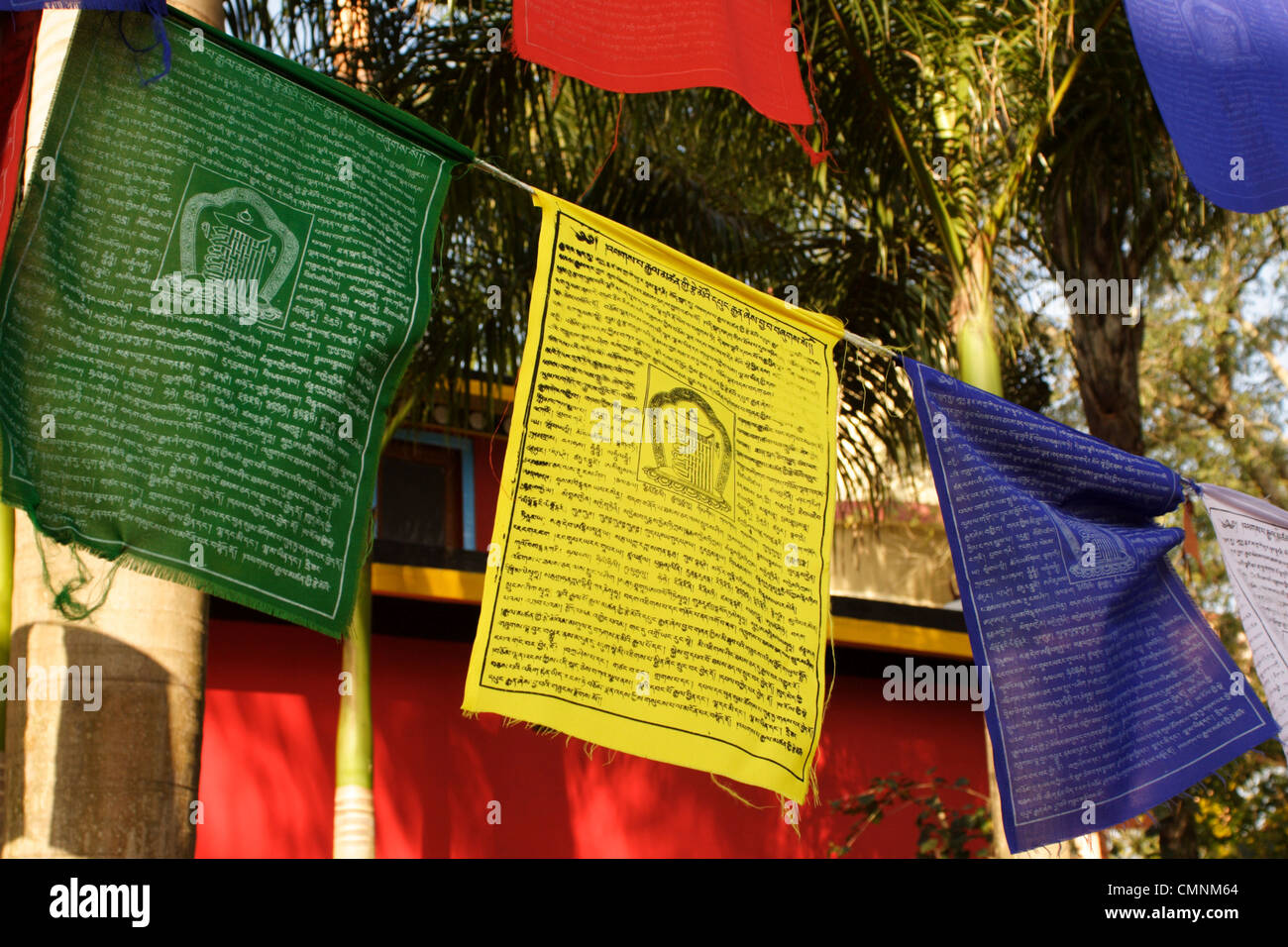 Tibetan prayer flags outside the Golden Buddha monastery at Kushalnagar ...