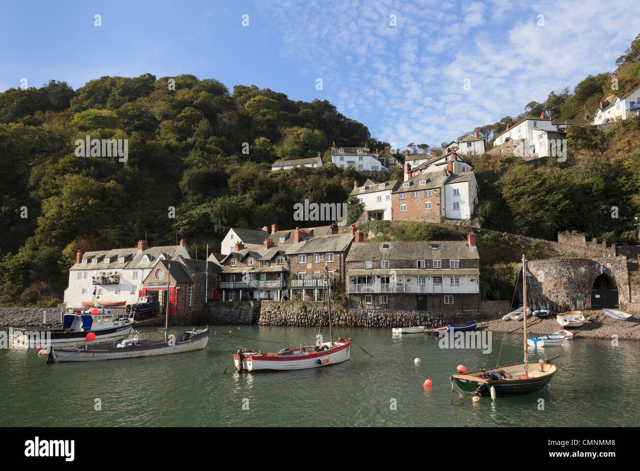 View of boats in the harbour below the village on a steep hillside on ...