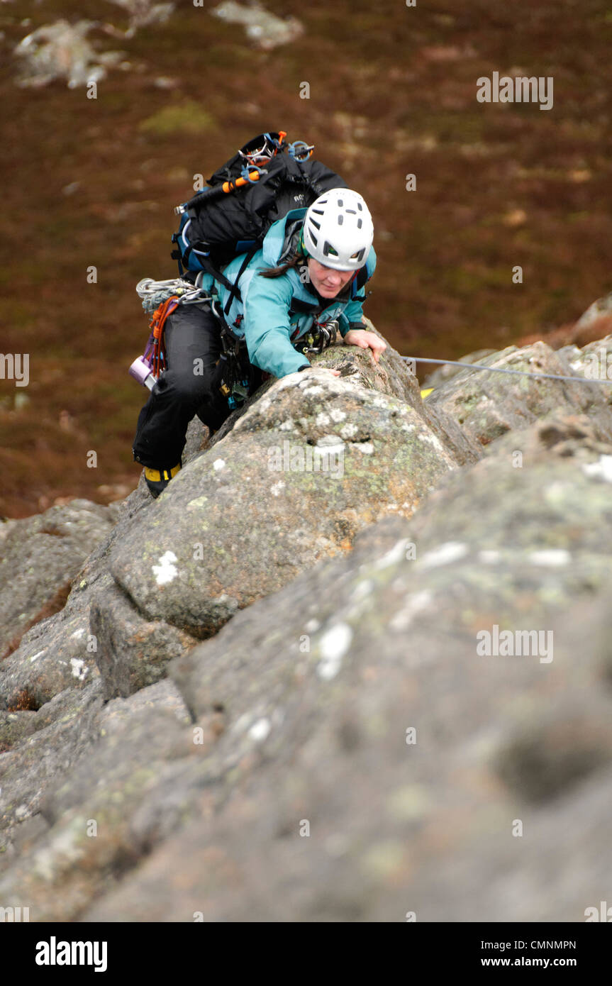A climber leading Afterthought Arete in the Cairngorm mountains Stock ...