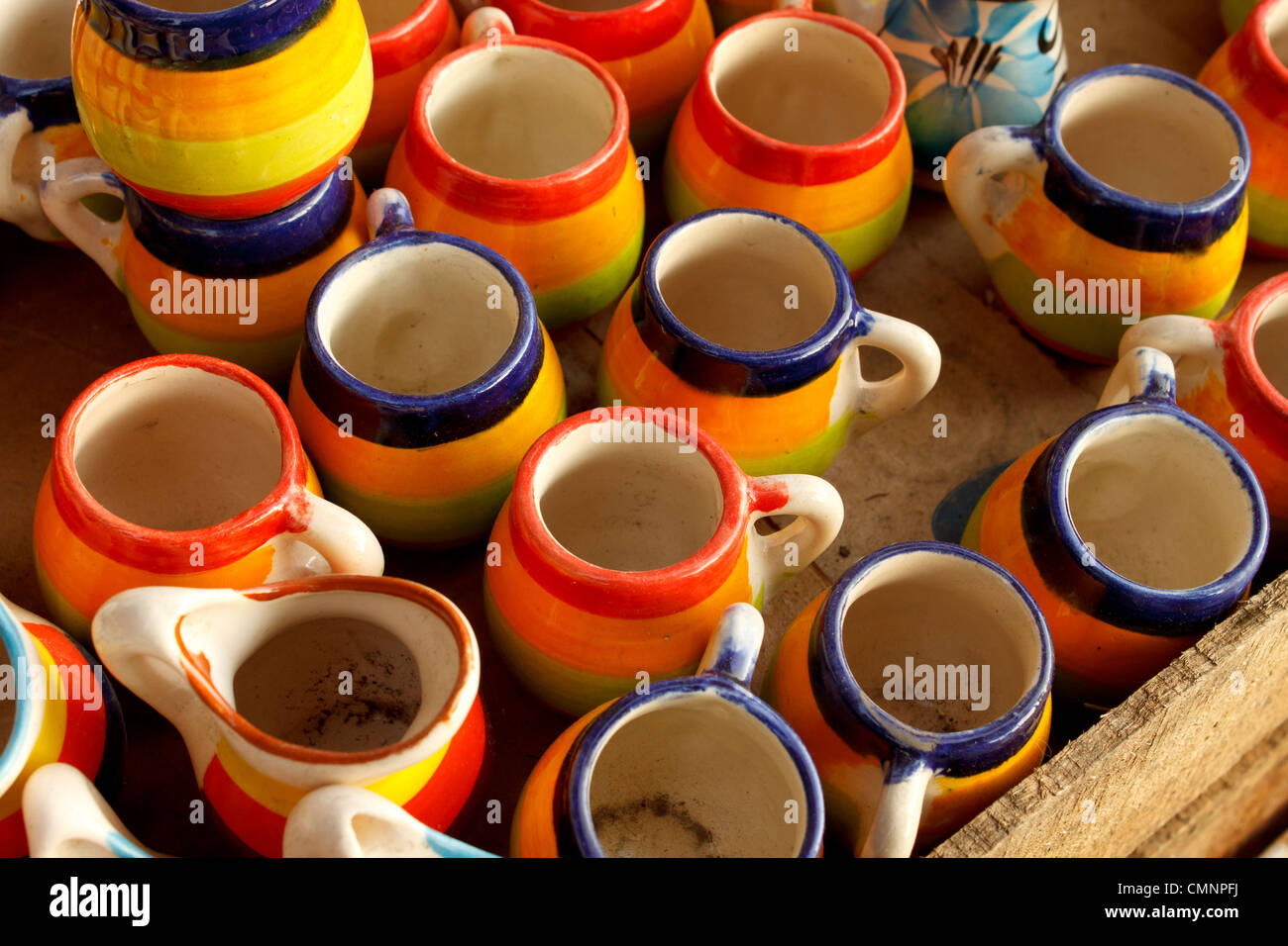 Variety of colorful handmade ceramic pots at outdoor market in Mexico ...