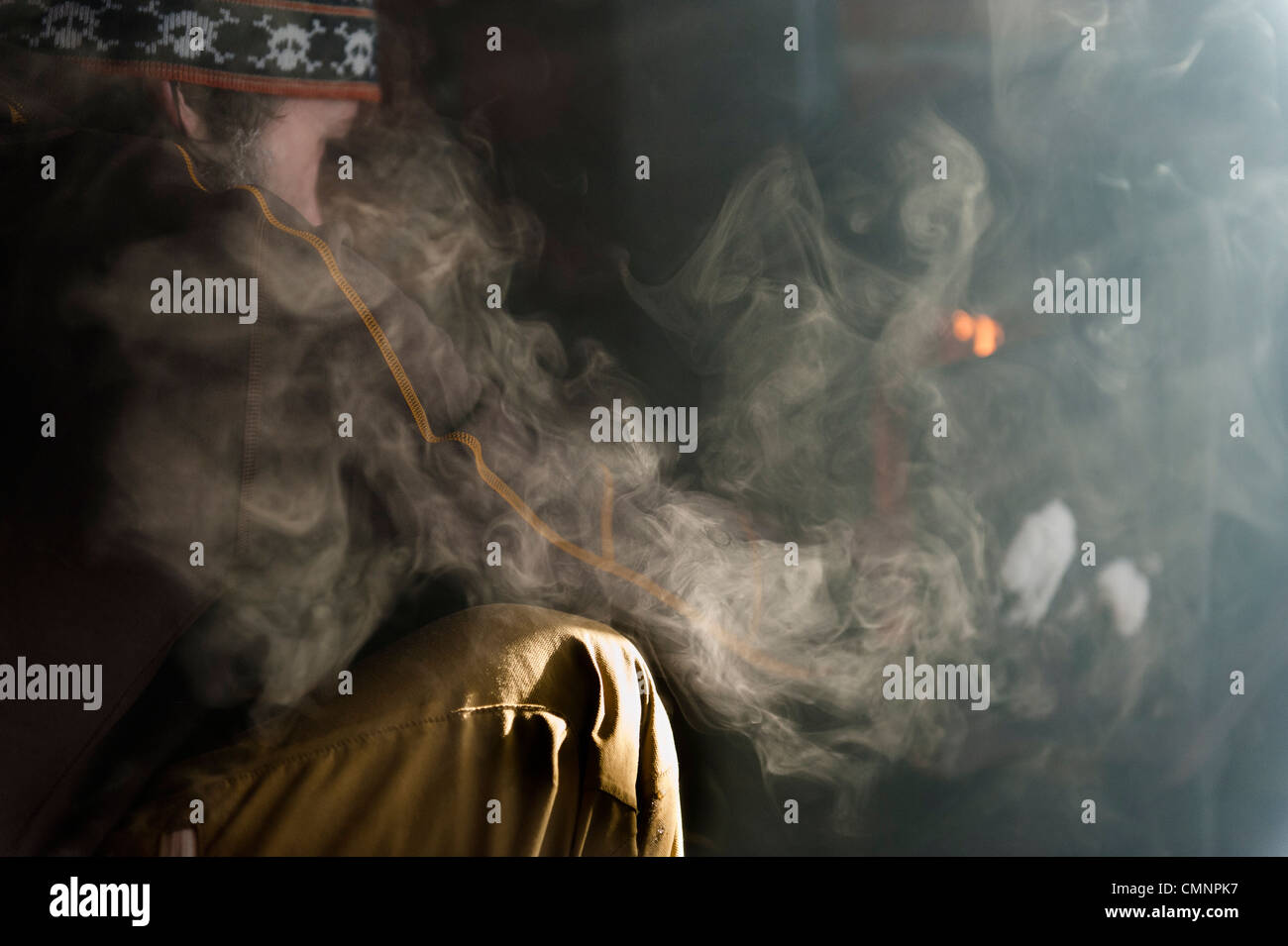 A man initiating fire inside a hut in Kittilä, Finnish Lapland Stock ...