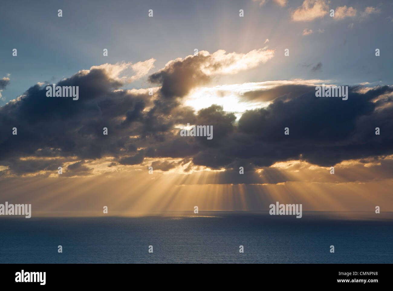 Sun bursting through clouds above Coral Sea. Cooktown, Queensland ...