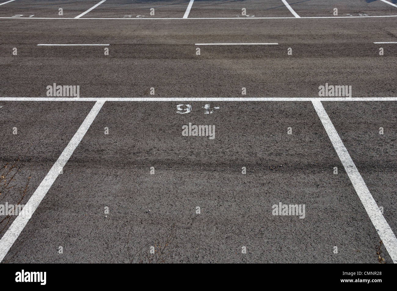 Dividing lines in empty asphalt paved parking lot abstract background ...