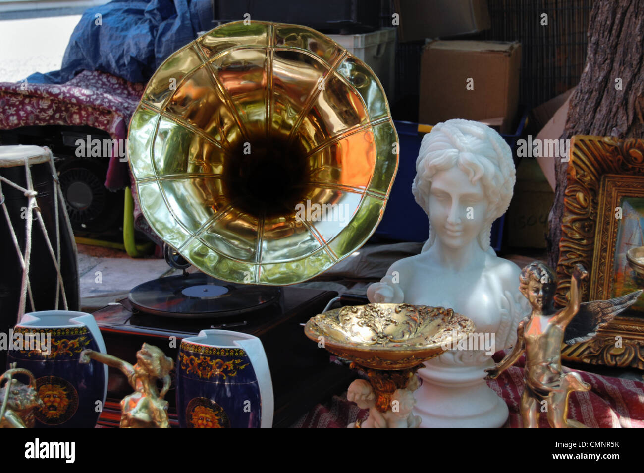 Vintage gramophone vinyl record player and antique objects at street ...