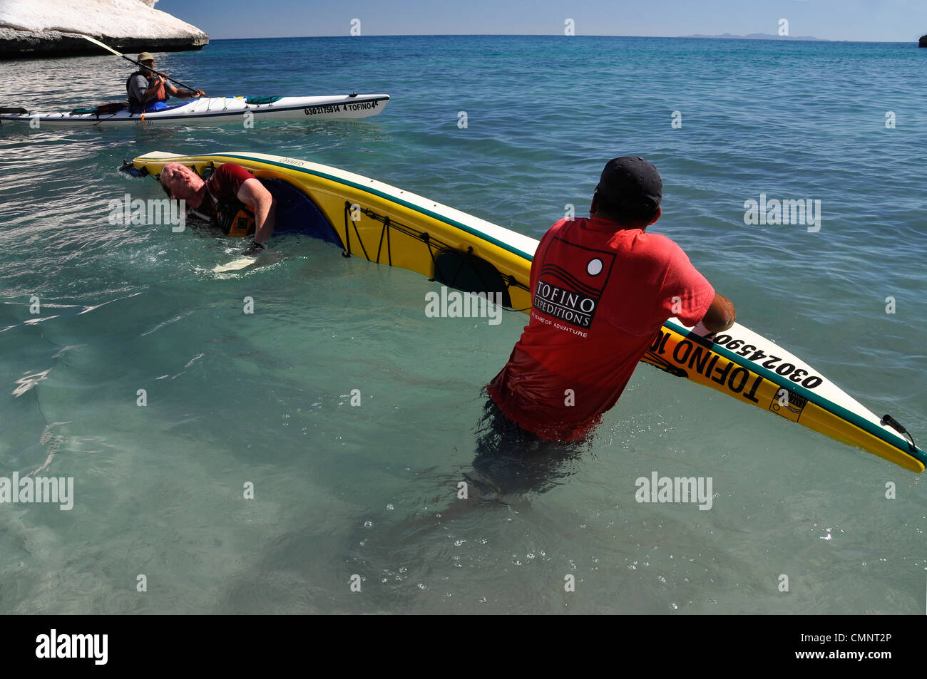 Guide teaching how to roll a sea kayak, Sea of Cortez, Loreto Bay ...