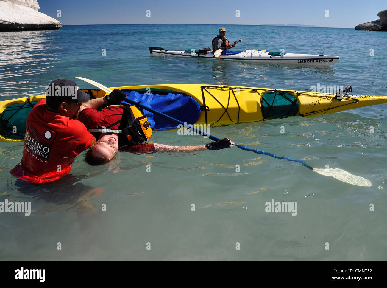 Guide teaching how to roll a sea kayak, Sea of Cortez, Loreto Bay ...