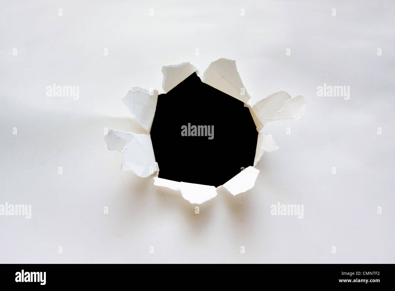 Paper hole background Stock Photo - Alamy