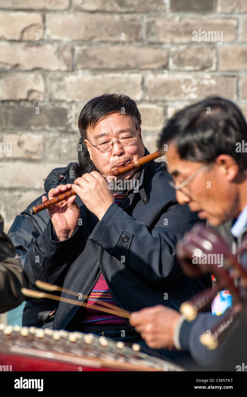 Two Chinese men play Chinese instrument in the open music concert in ...
