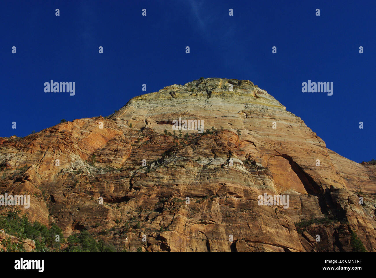 Mighty rock wall under blue sky, Zion National Park, Utah Stock Photo ...