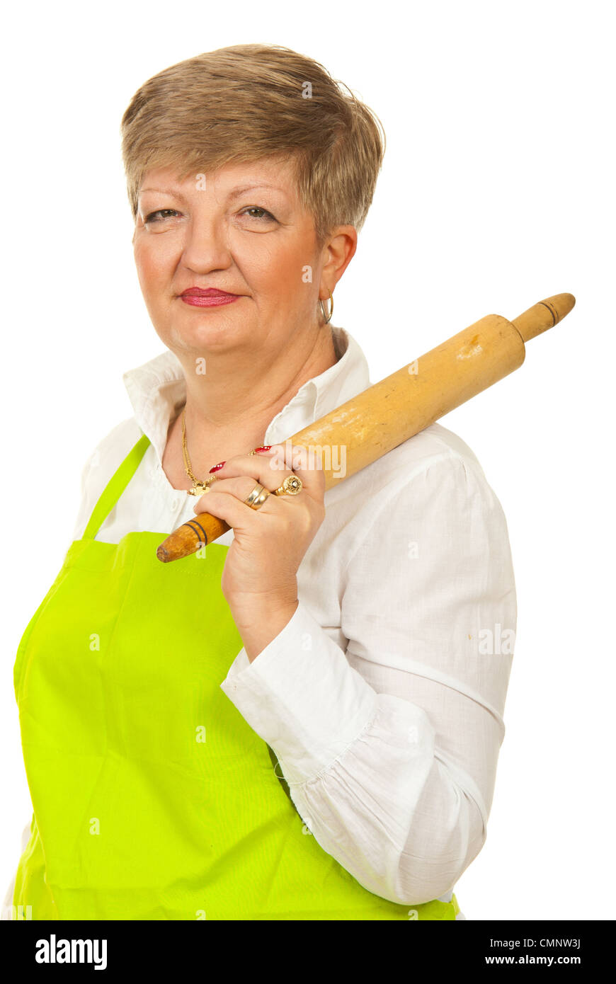 Smiling mature woman holding rolling pin on her shoulder isolated on ...