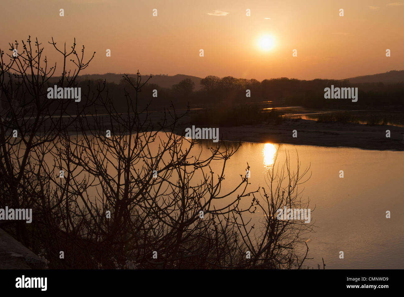 A Beautiful sunset over the side of a river Stock Photo - Alamy