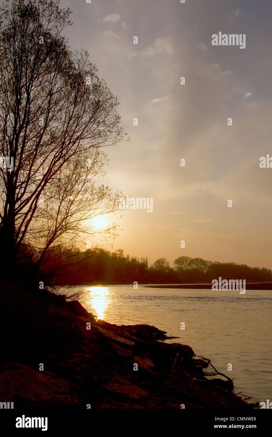 A Beautiful sunset over the side of a river Stock Photo - Alamy