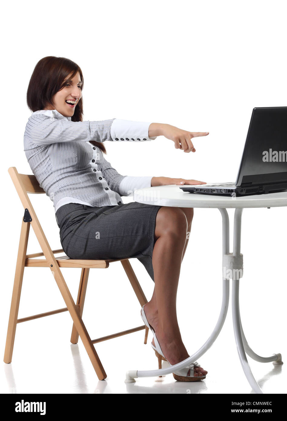 Happy women sitting with computer isolated on the white background ...