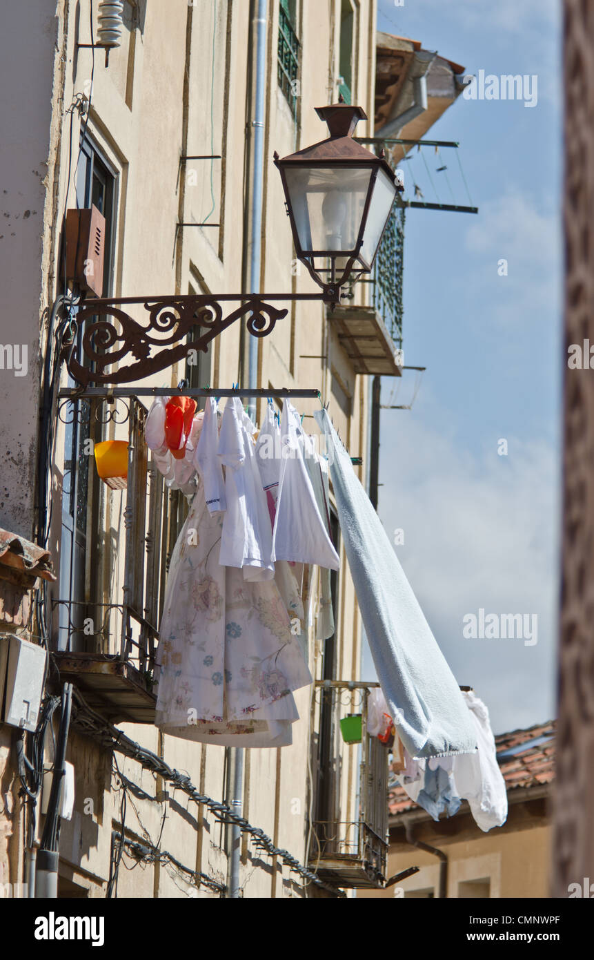 Washing on clothes line outside old apartment Stock Photo - Alamy