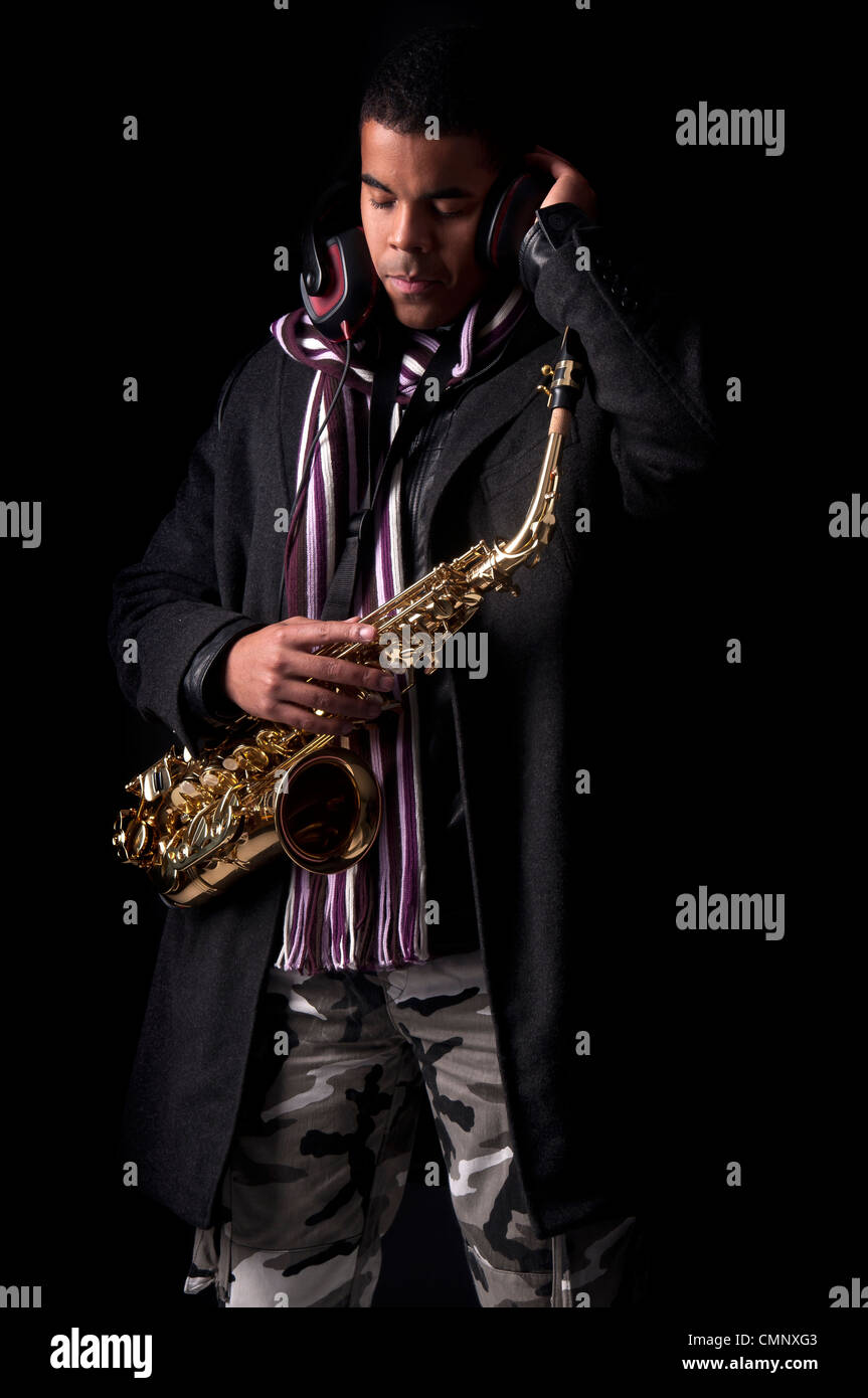 Stylish man playing the saxophone Stock Photo - Alamy