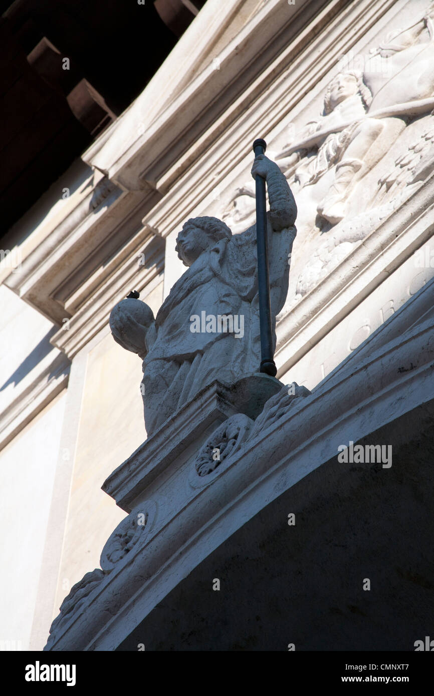 Religious statue on a church in Venice Italy Stock Photo - Alamy