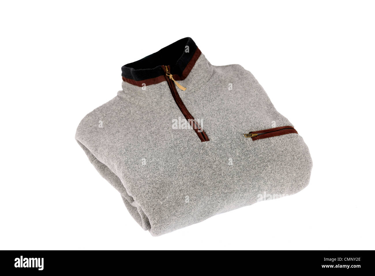 A folded light grey pullover style fleece lined jacket on a white ...