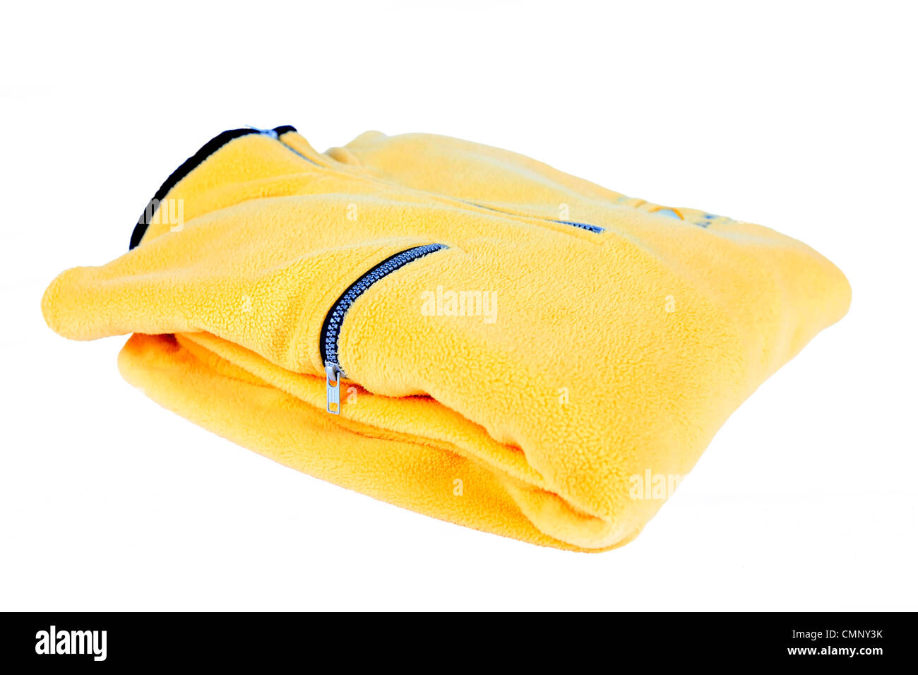 A folded yellow Fleece pullover jacket on a white background Stock ...
