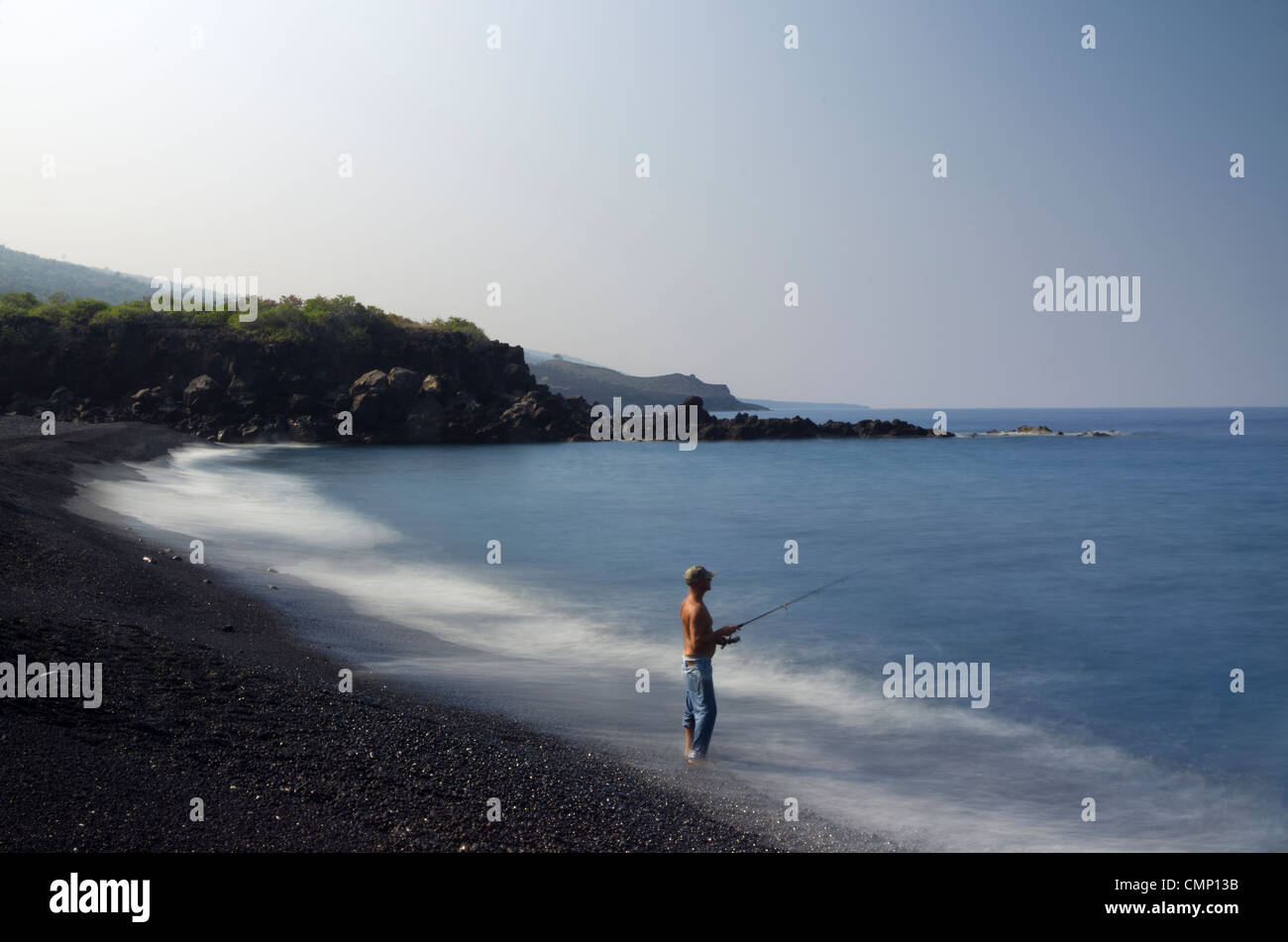 Fishing on a pebble beach, Big Island, HI Stock Photo - Alamy