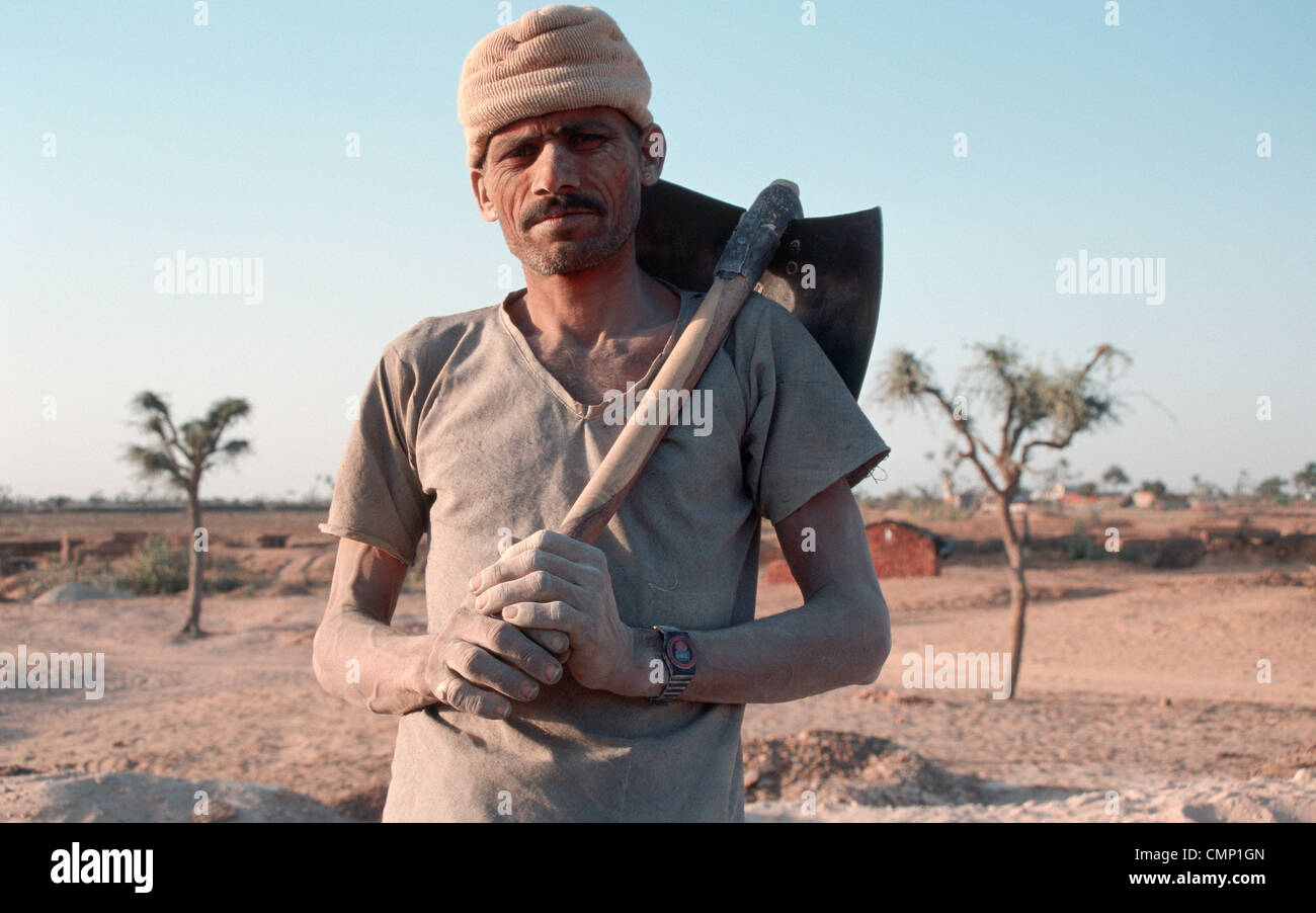 Man working in a quarry ( India Stock Photo - Alamy