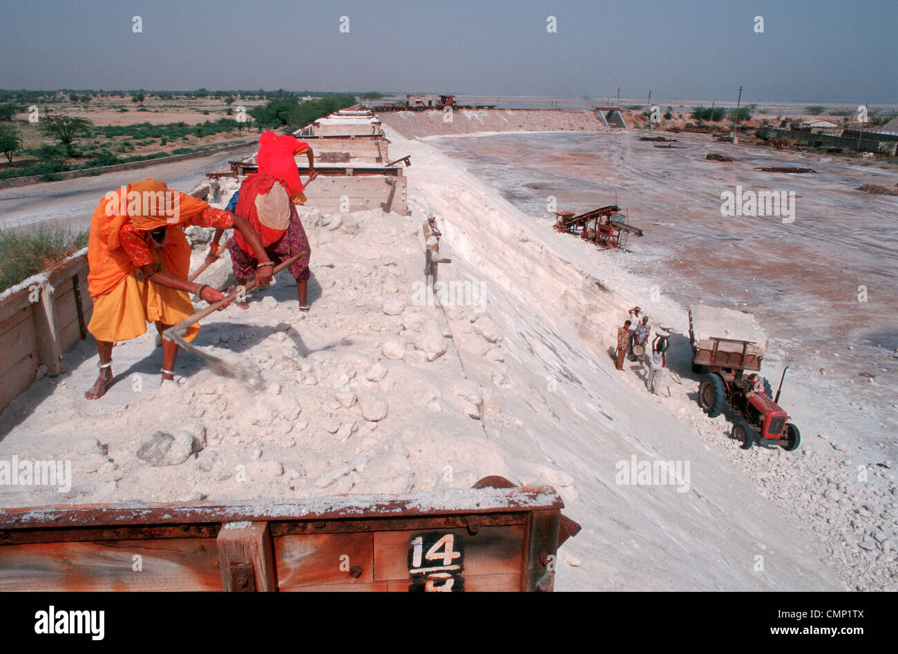 Women downloading salt from a train ( India Stock Photo - Alamy