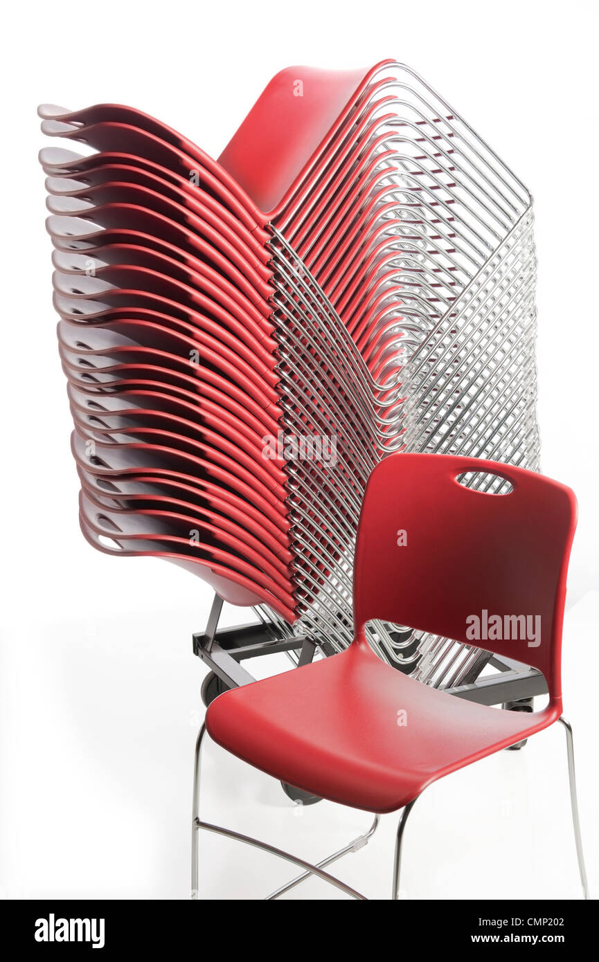 Stack of vibrant orange plastic chairs for a conference Stock Photo - Alamy