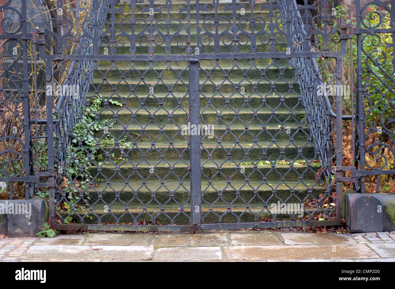 Old iron gate closed and stone steps Holy Cross Church Wroclaw Poland ...