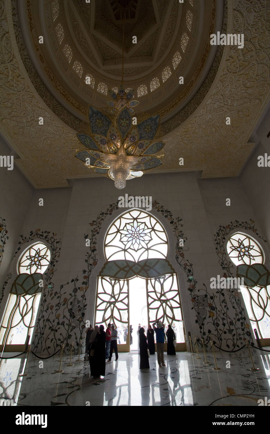 Visitors walk towards Intricately designed doors at the Sheikh Zayed ...
