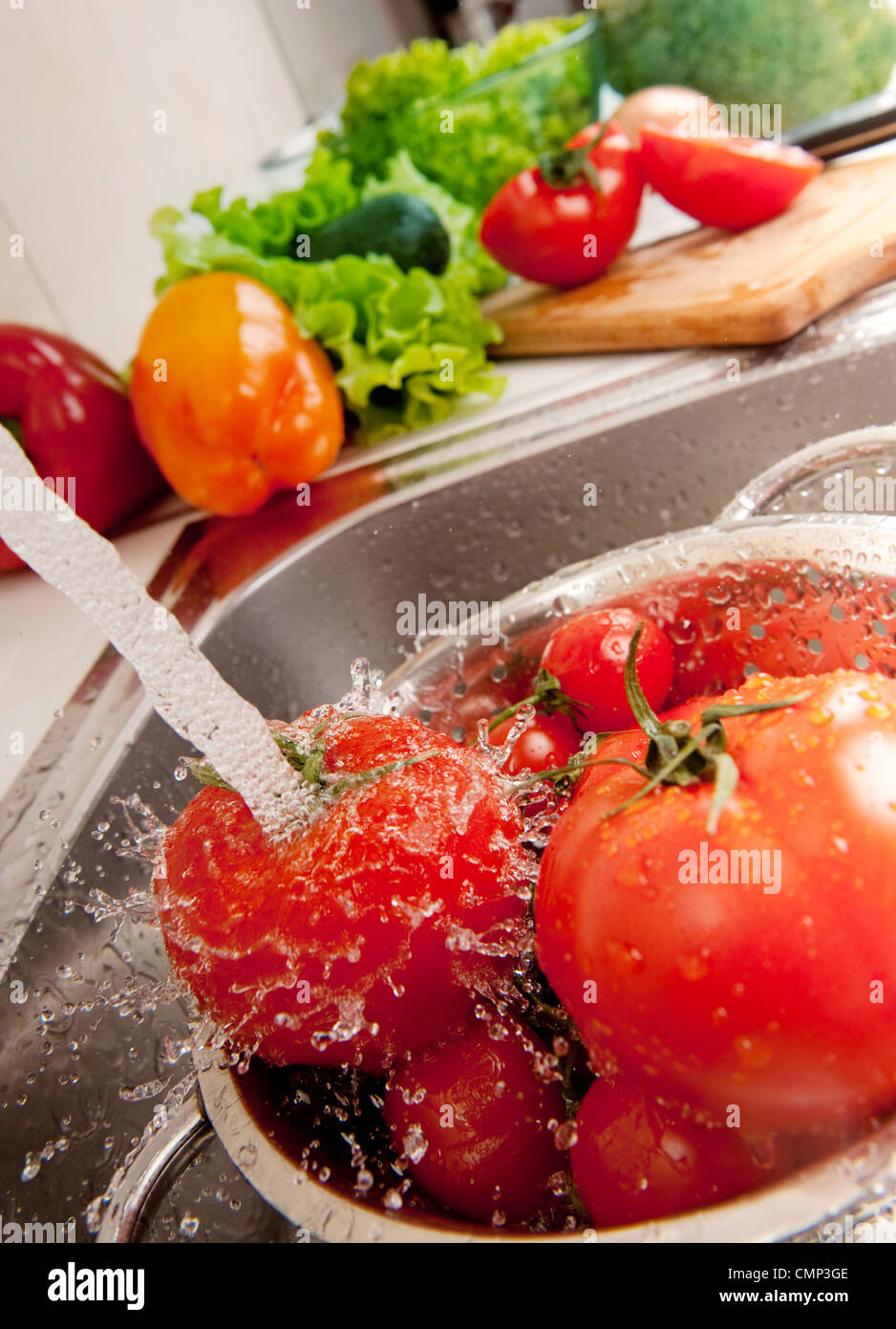 Fresh vegetables splashing in water before cooking Stock Photo - Alamy