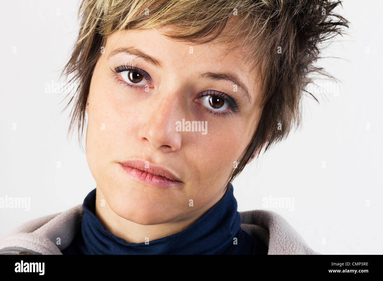 Beautiful young woman makes a sad face - female expression with a ...