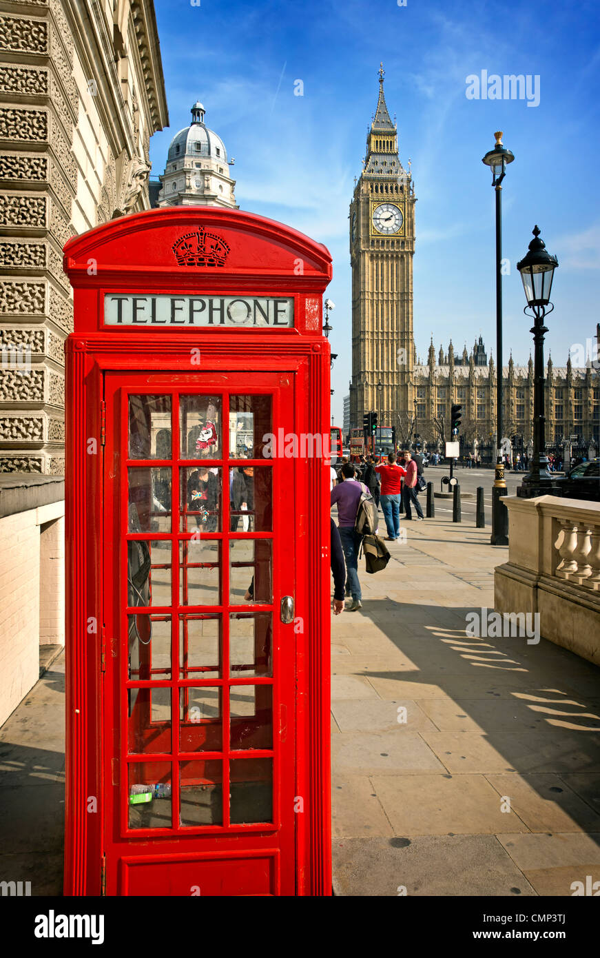 A bright red telephone box in front or Parliament in Westminster Stock ...