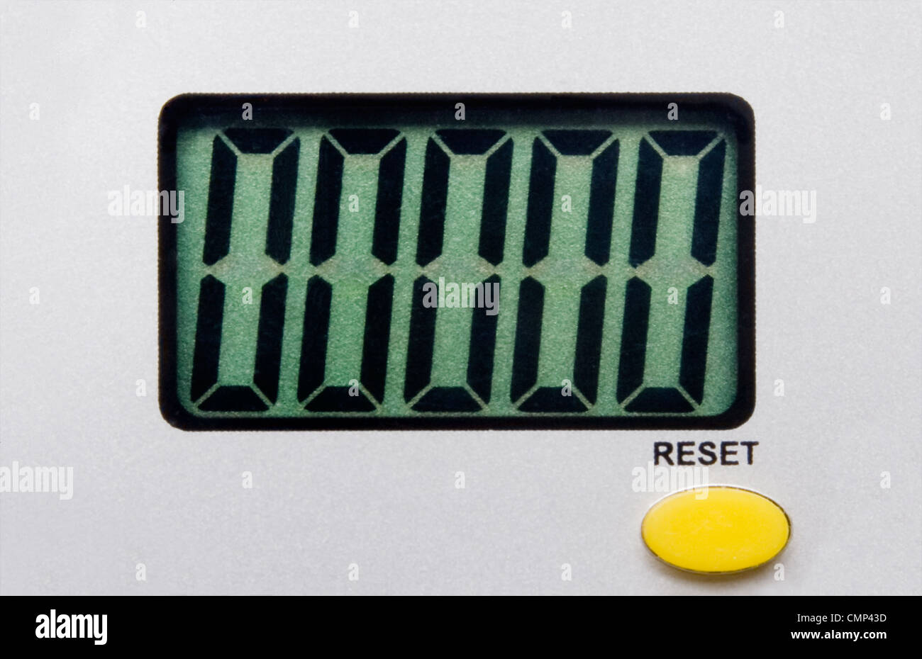 Crude LCD with 5 zeros and yellow button and the word "Reset". Light ...