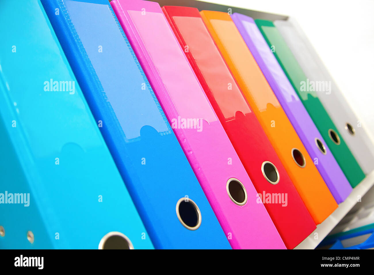 Colorful office folders on the bookshelf Stock Photo - Alamy