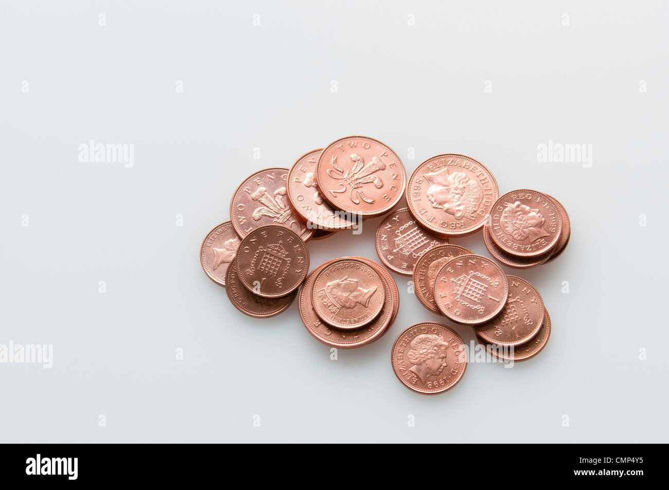 Pile of one and two pence coins on white background Stock Photo - Alamy