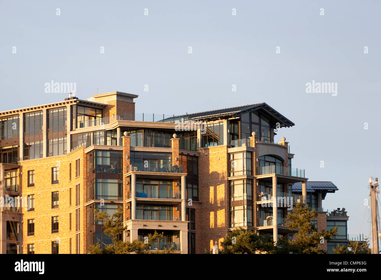 A luxury apartment building at sunset Stock Photo - Alamy
