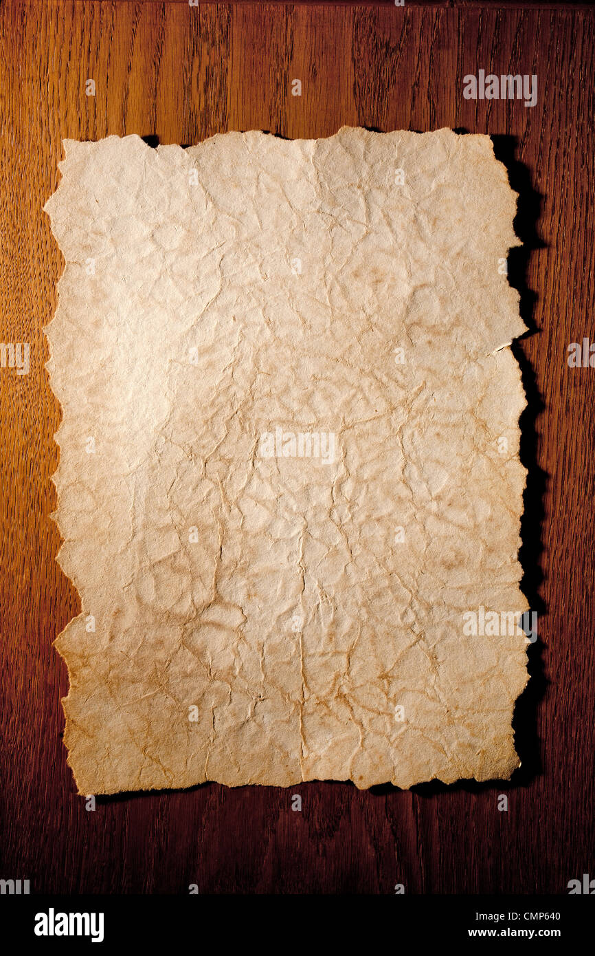 Old paper on the wood Stock Photo - Alamy
