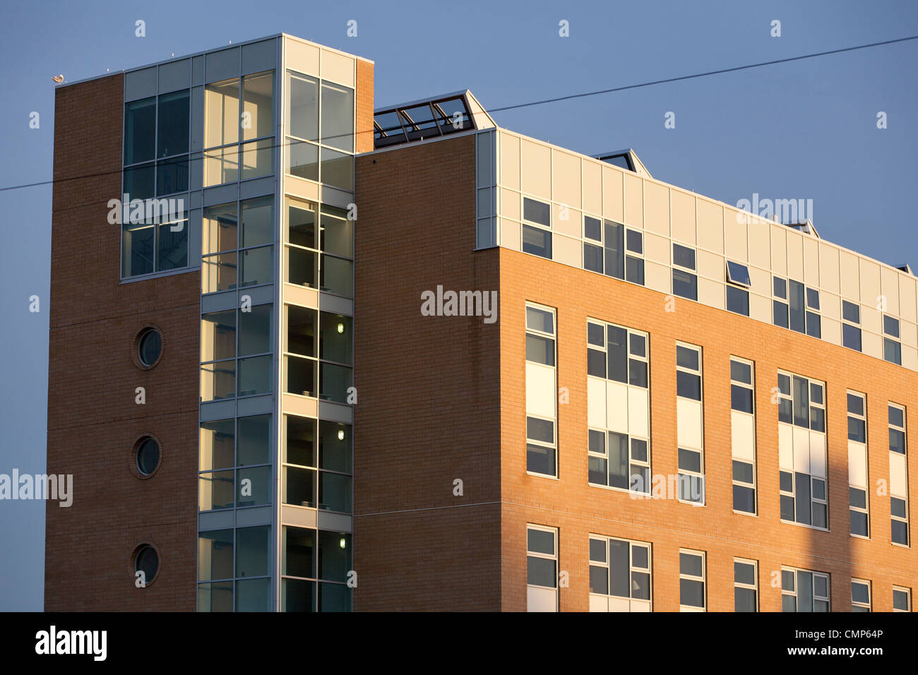 A building with many windows at sunset Stock Photo - Alamy