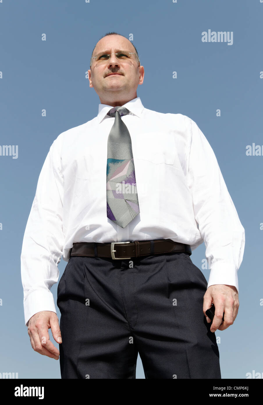 one businessman with sunglasses and blue background Stock Photo - Alamy