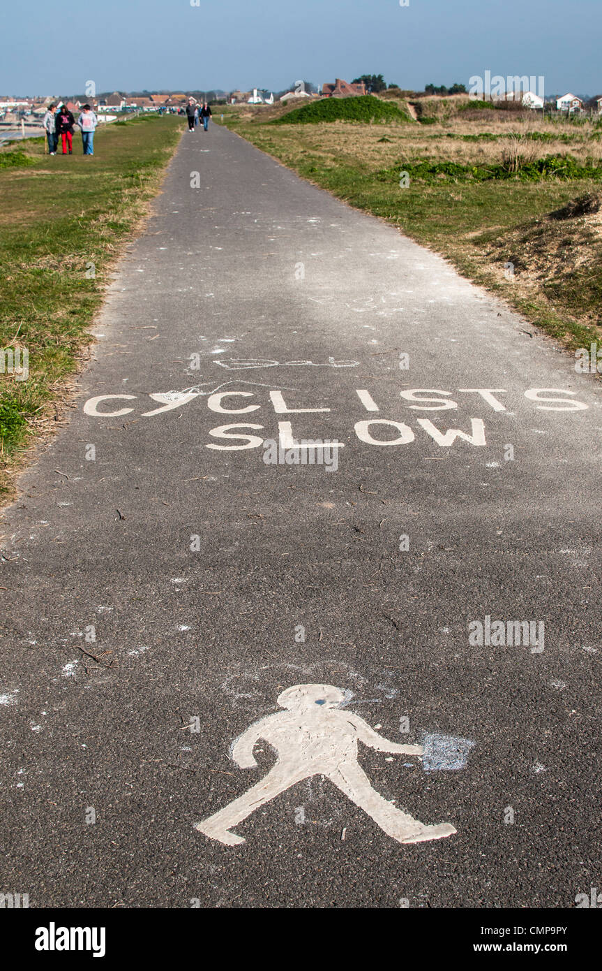 'Cyclists Slow' Sign on a Public Path Stock Photo - Alamy