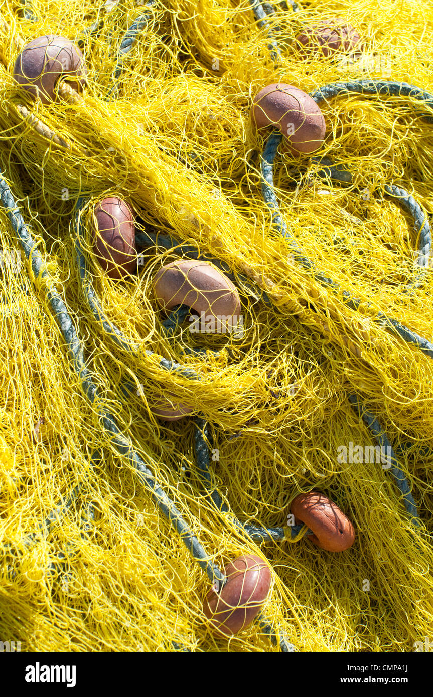 Yellow fishing net background Stock Photo - Alamy
