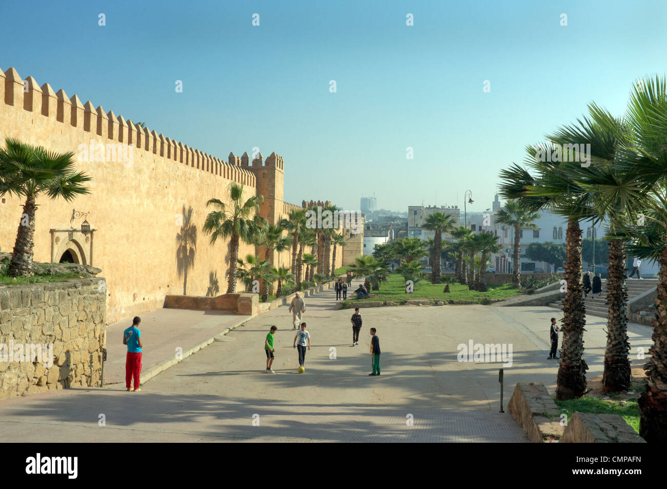The wall of the Medina old town Salé Morocco with children playing ...
