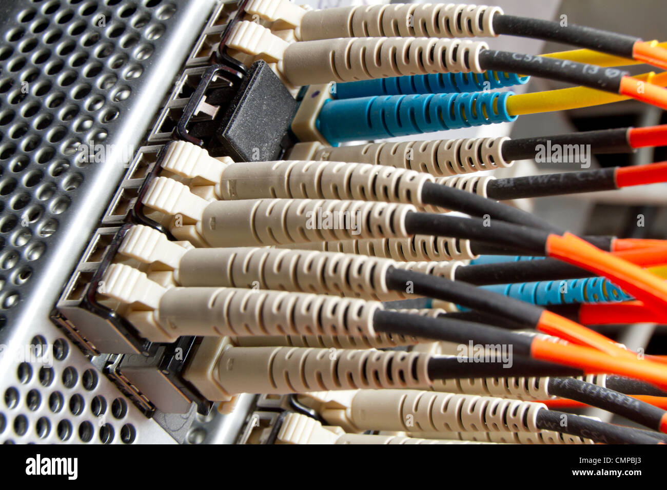 optic fiber cables connected to hub Stock Photo - Alamy
